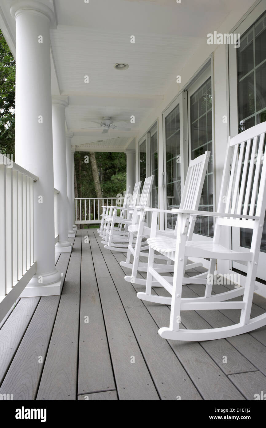 PORCH: all white porch, classic columns with four white rocking chairs ...