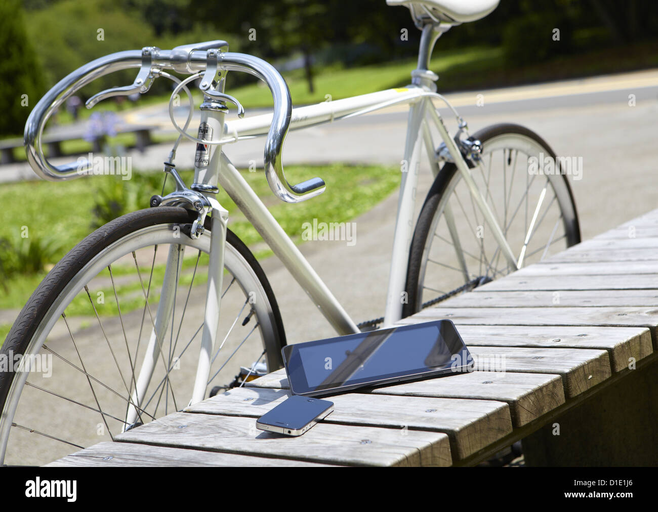 Bicycle and a tablet PC Stock Photo - Alamy