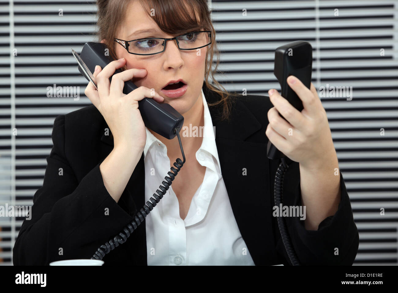 Woman tied up telephone hi-res stock photography and images - Alamy