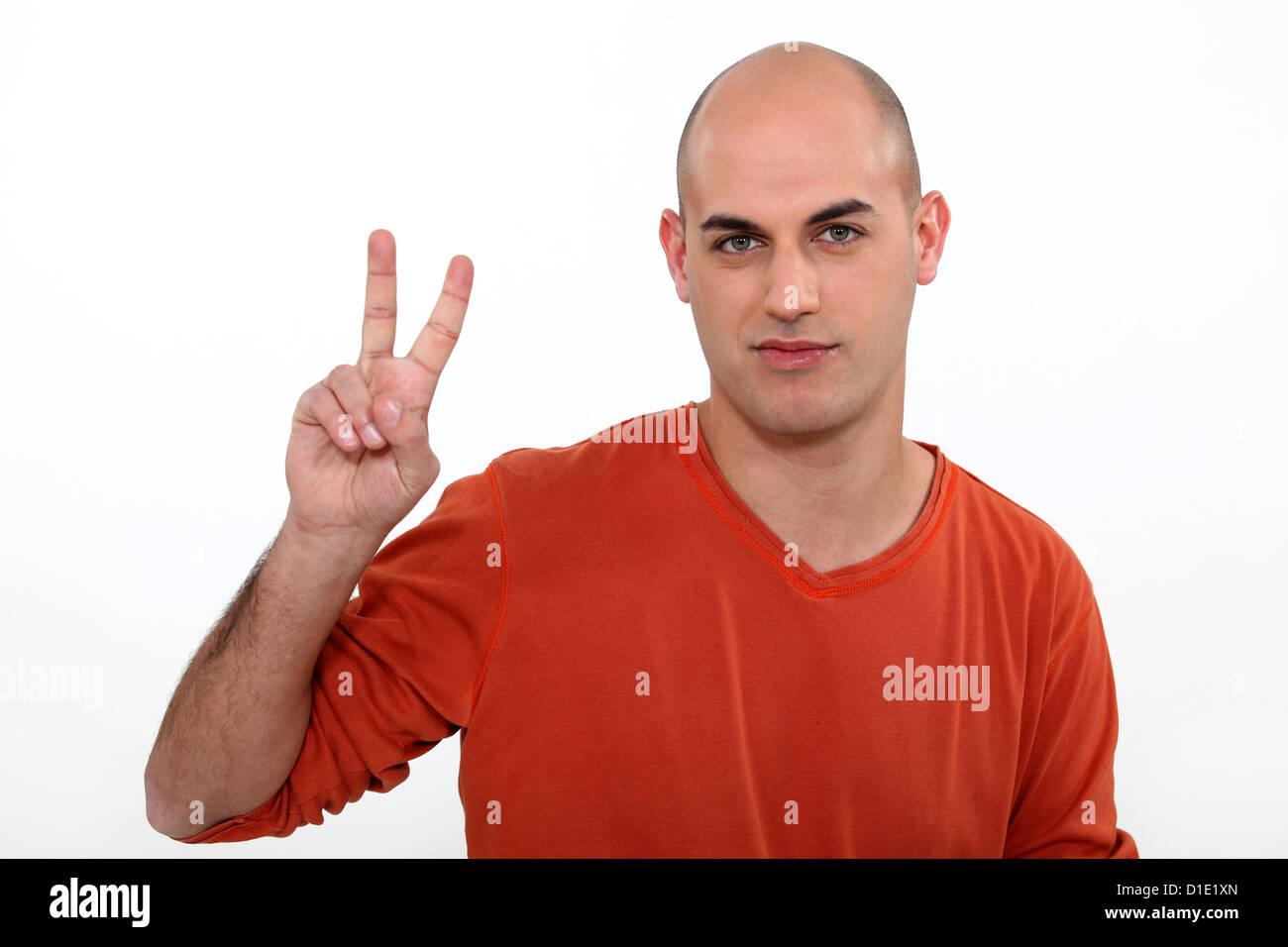 Man giving the peace sign Stock Photo - Alamy