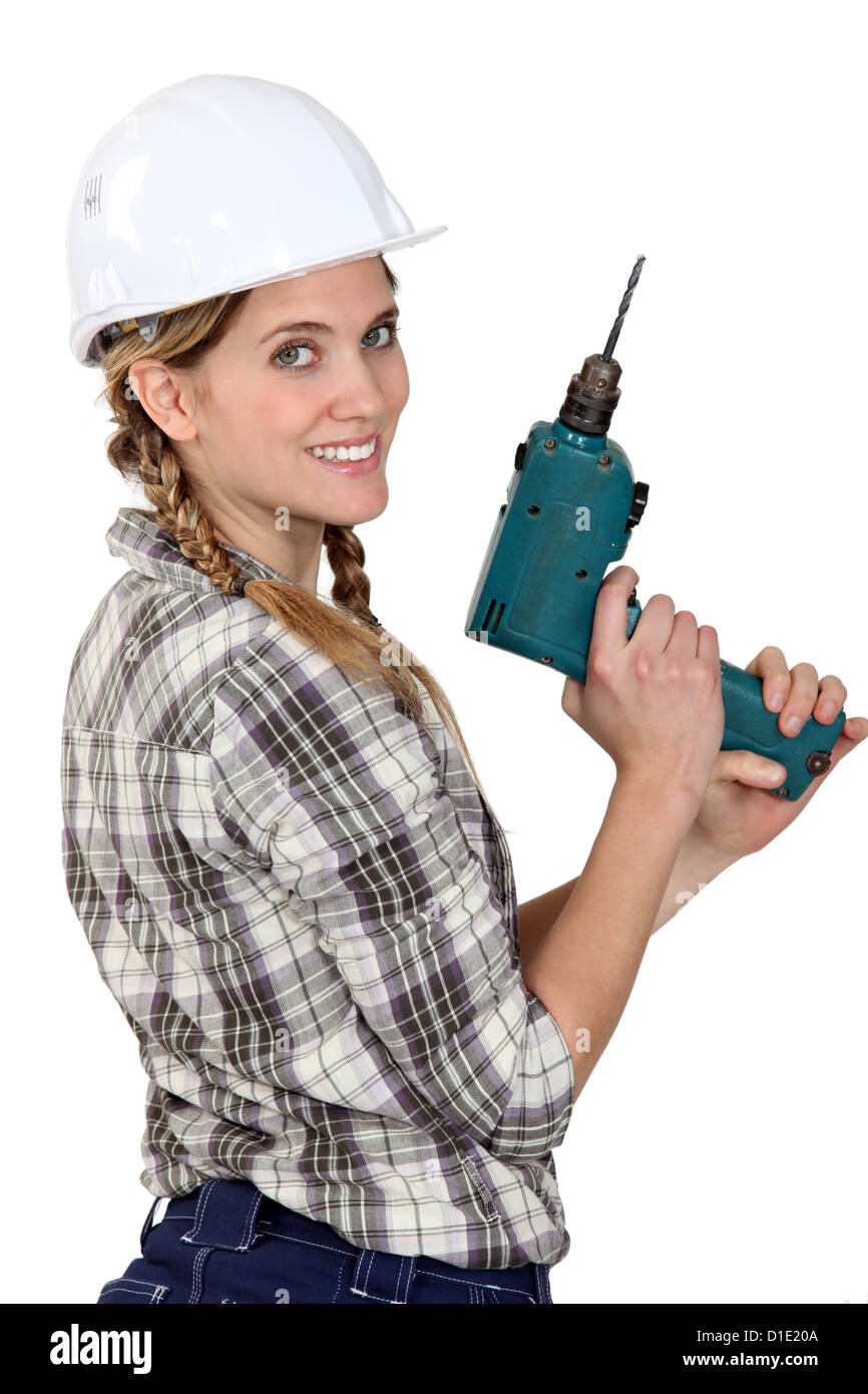 Blond woman holding electric drill hi-res stock photography and images ...