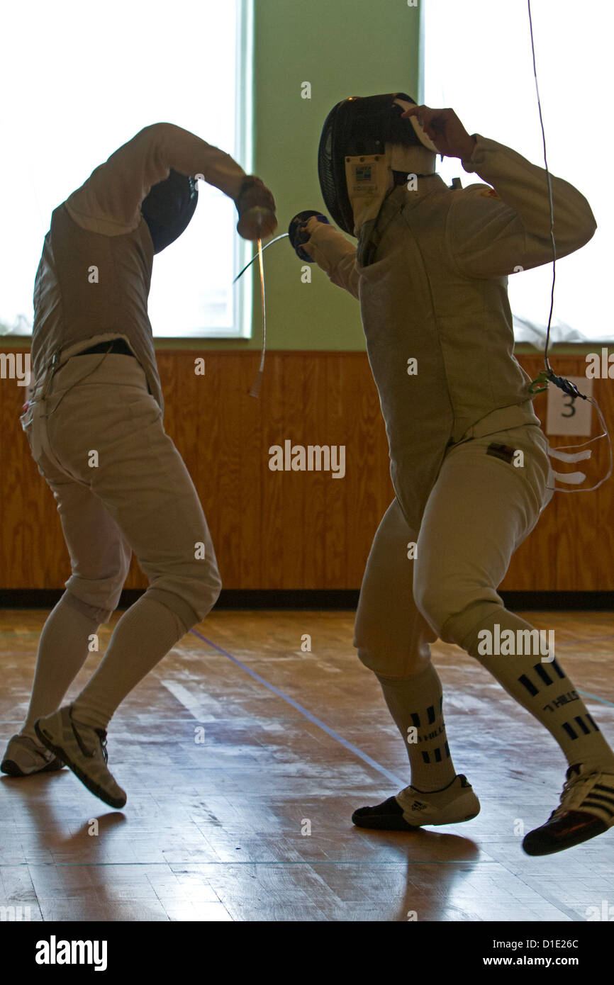 Two fencers in a match Stock Photo - Alamy