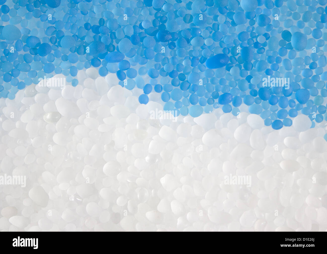 Blue and white colored glass grains Stock Photo - Alamy