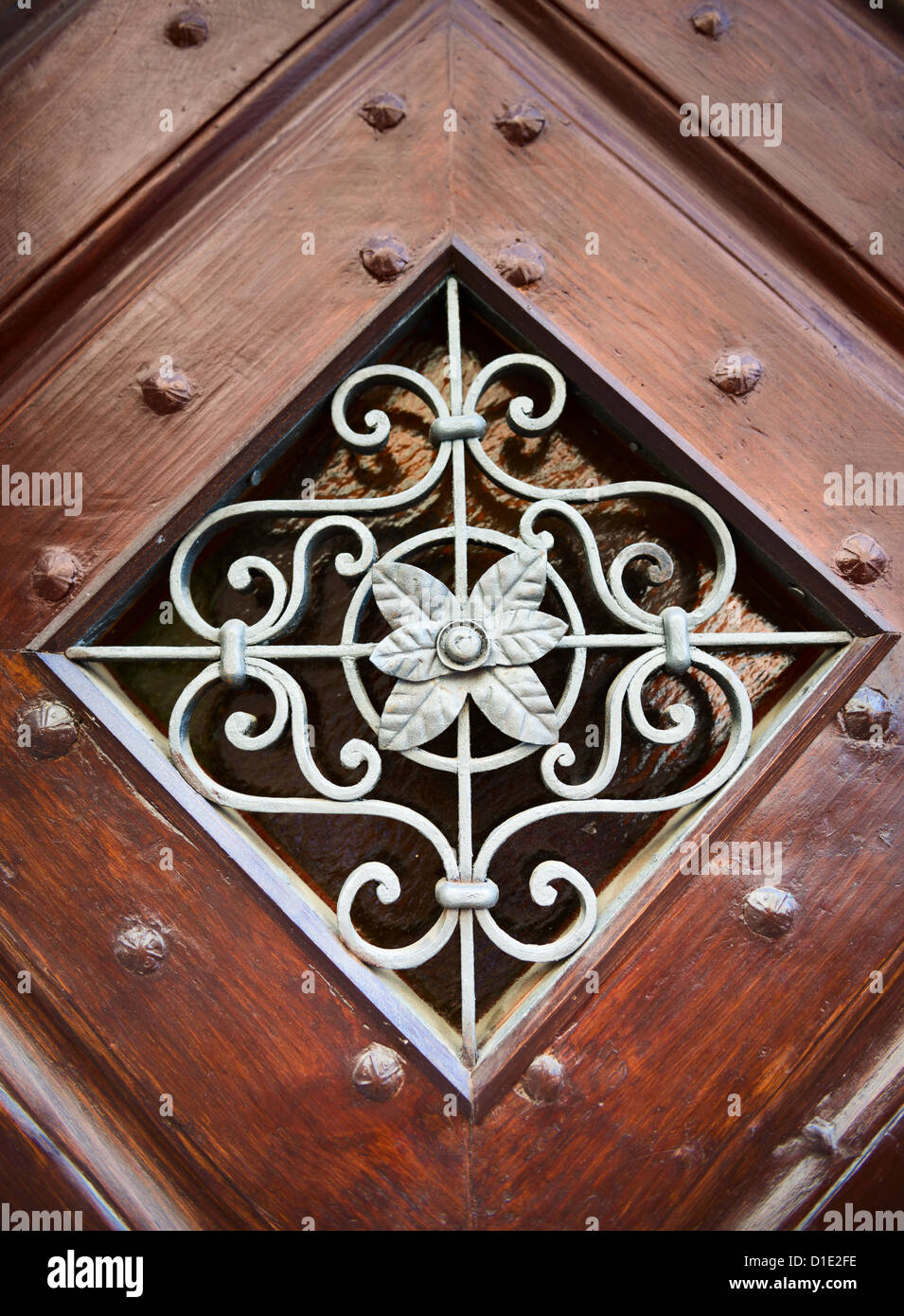 Metal ornamental pattern with leaves in wooden frame Stock Photo - Alamy