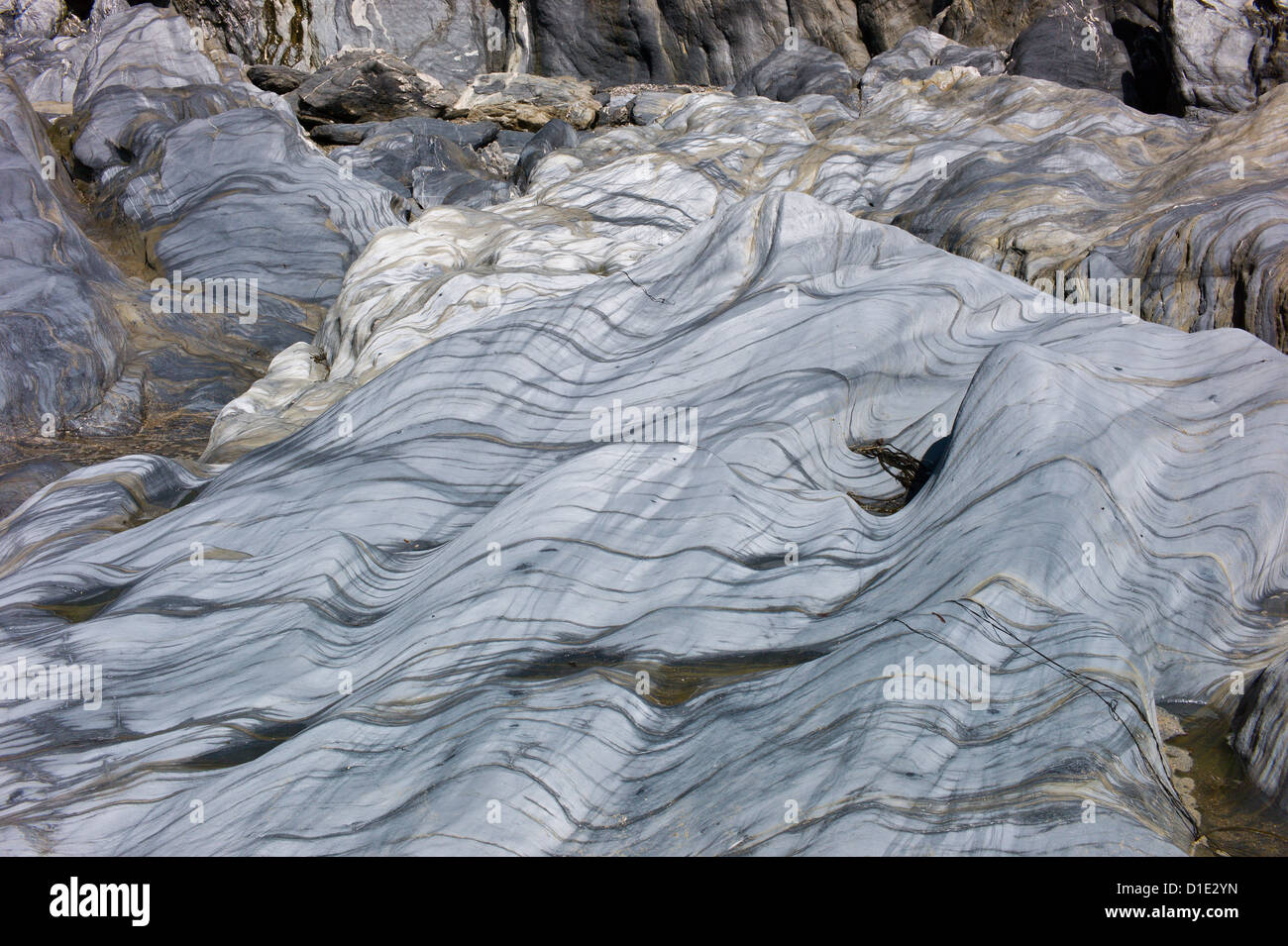 Rock formations on the beach and cliffs at Ayrmer Cove, Ringmore, Devon ...