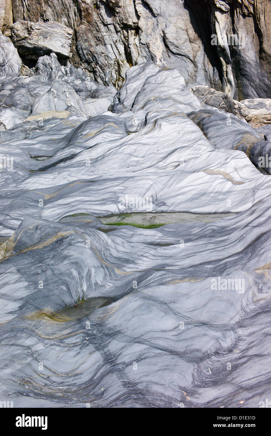 Rock formations on the beach and cliffs at Ayrmer Cove, Ringmore, Devon ...