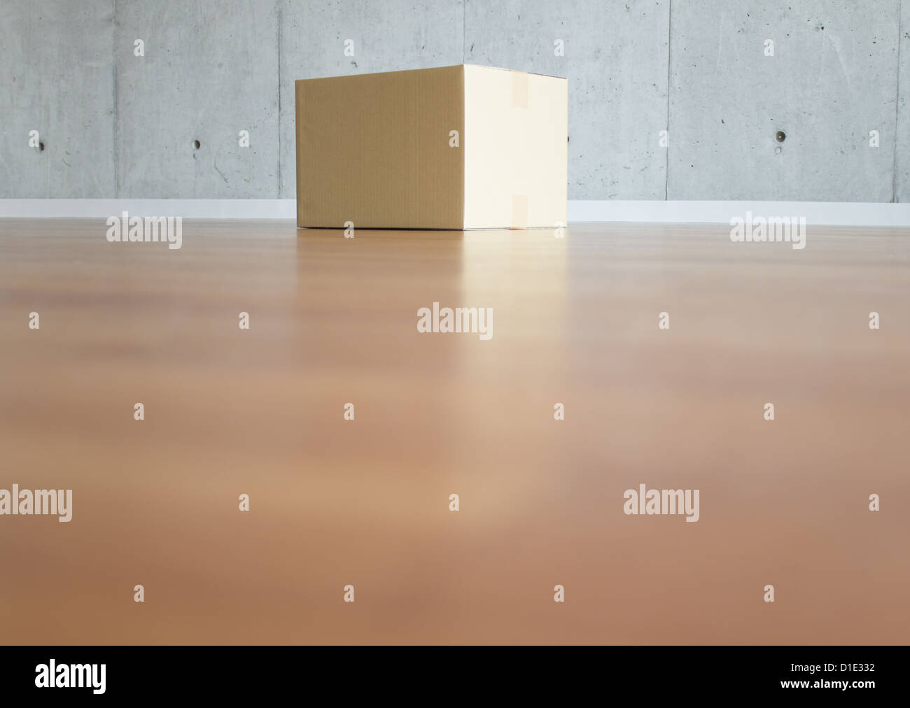 Concrete wall and a cardboard box Stock Photo - Alamy
