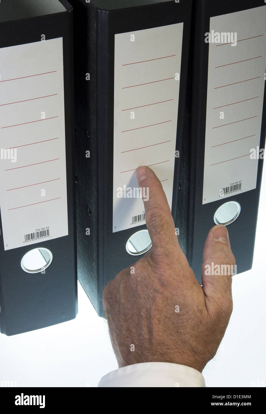 Symbol image,hand pointing to a file folder Stock Photo - Alamy