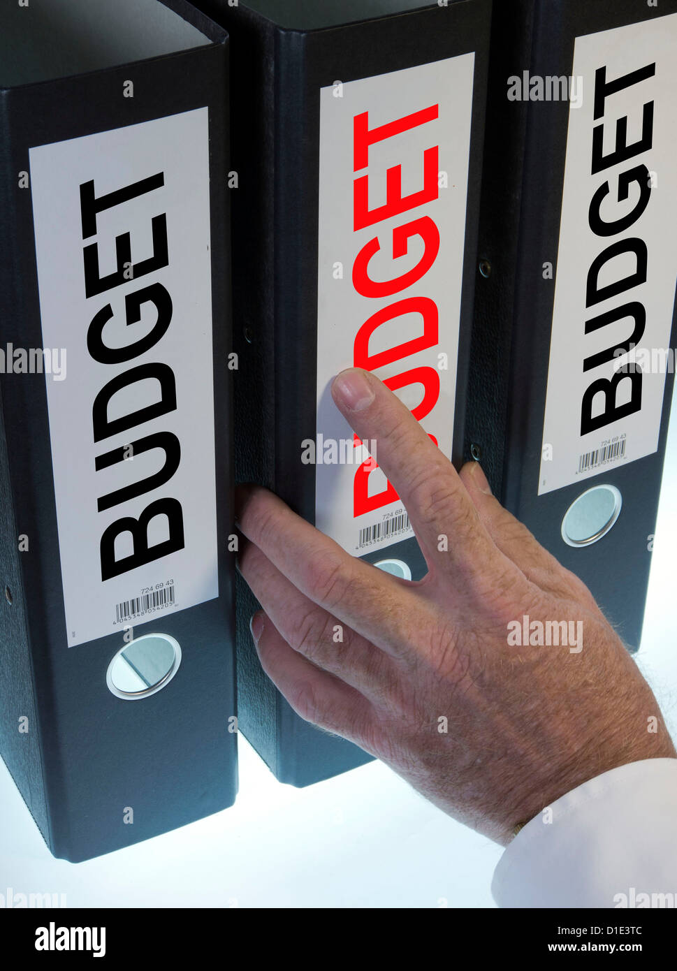 Symbol image, hand pointing to a file folder labeled with budget Stock ...