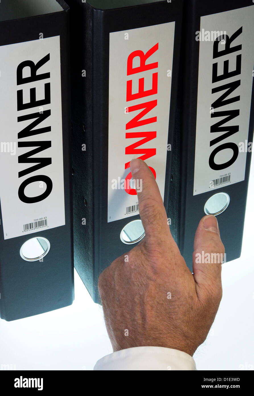 Symbol image, hand pointing to a file folder that says owner Stock ...