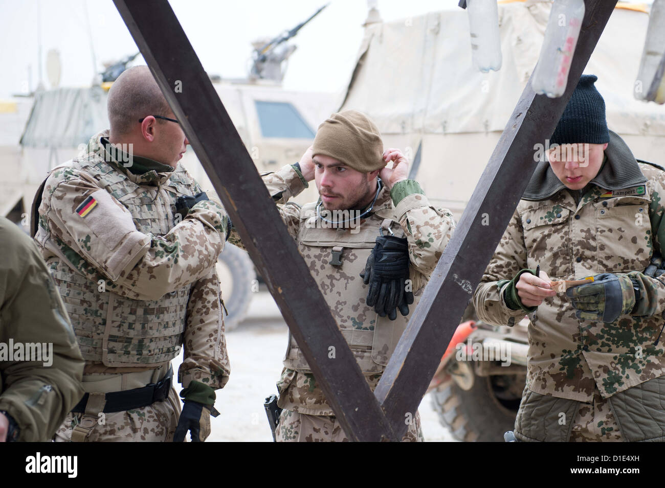 Soldiers of the German Armed Forces prepare for a patrol in Camp Marmal ...