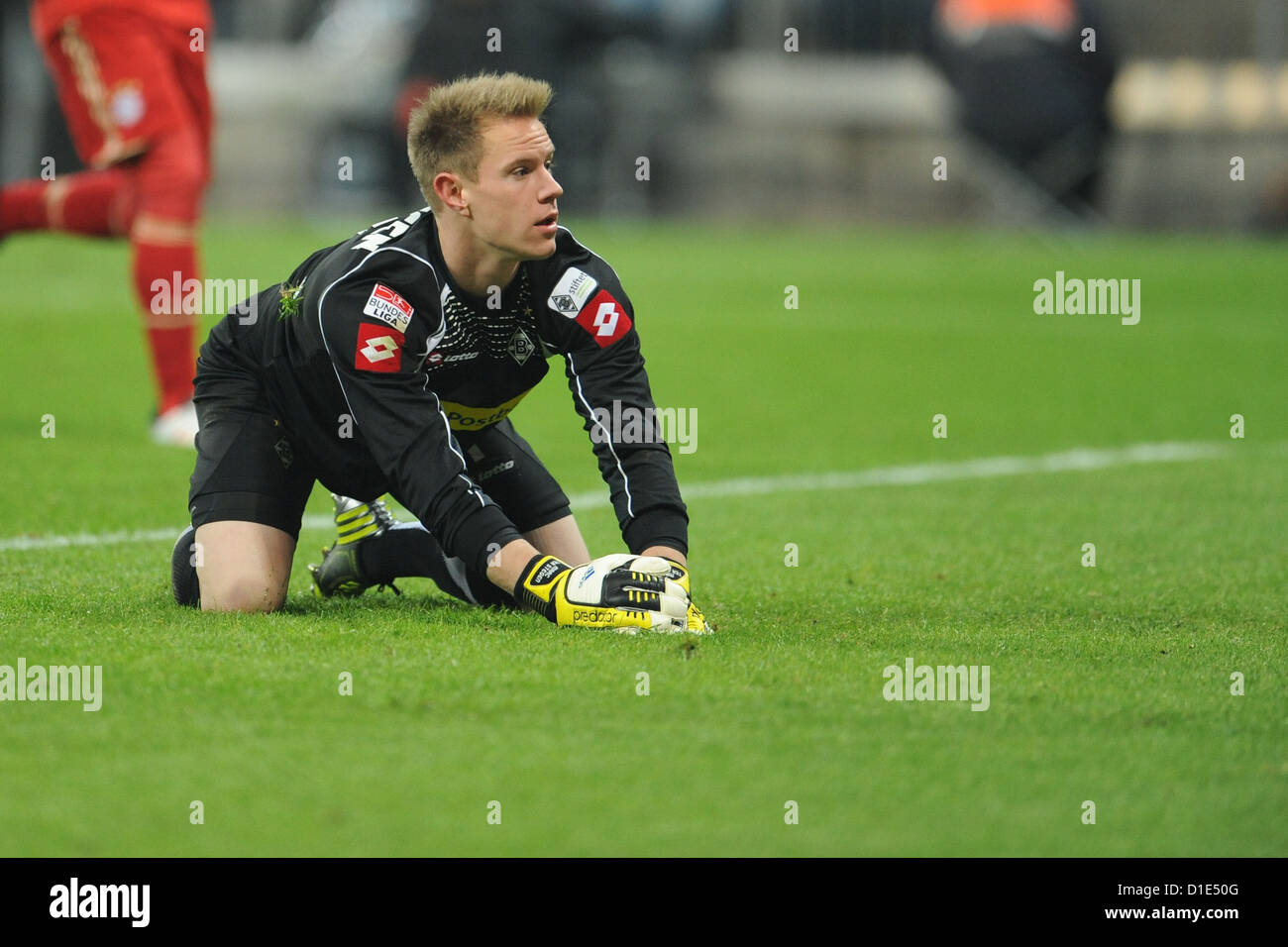 Gladbach's goalkeeper Marc-Andre ter Stegen kneels on the field during ...