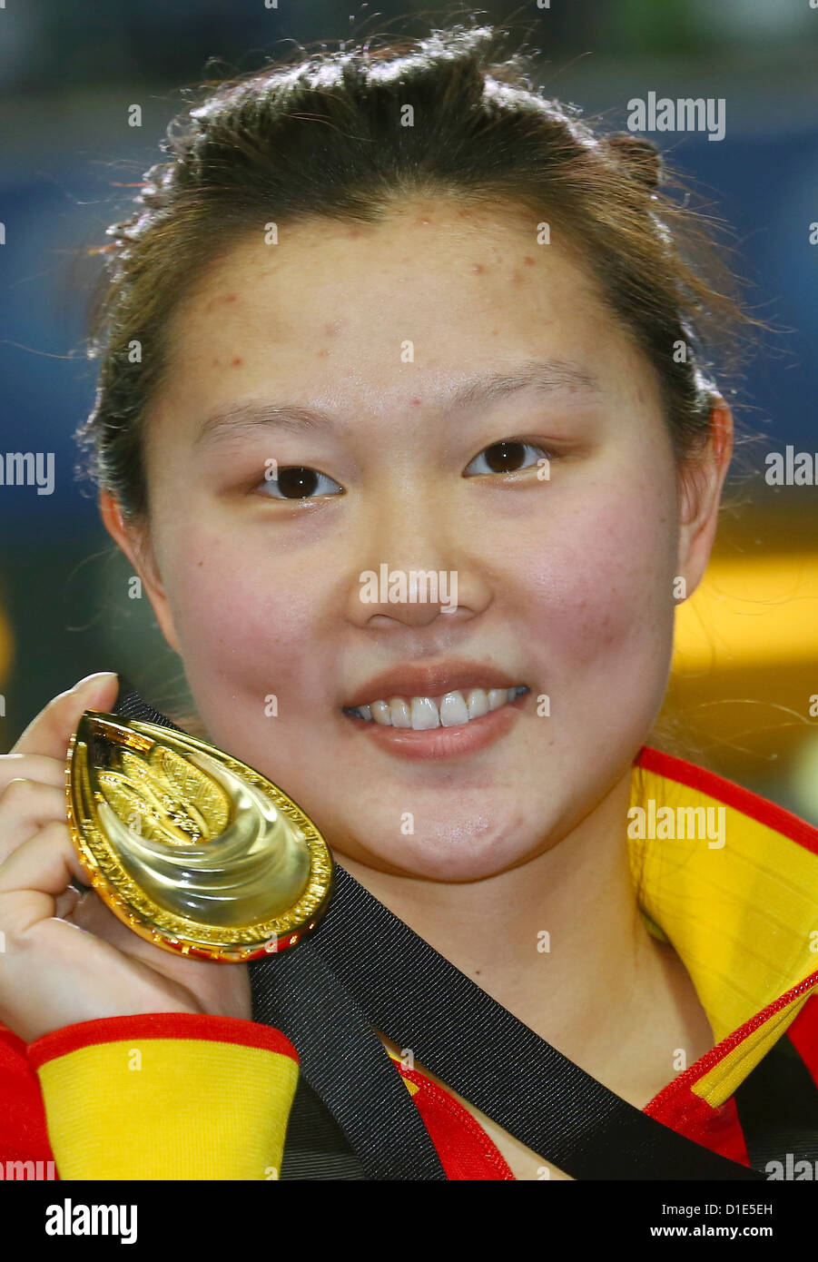 Jing Zhao of China presents her gold medal after winning the women's ...