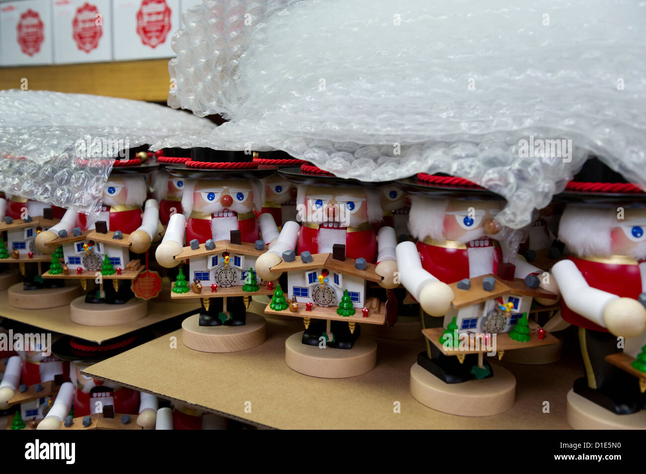 Nutcracker figures are covered with plastic tarps in a depot of the ...