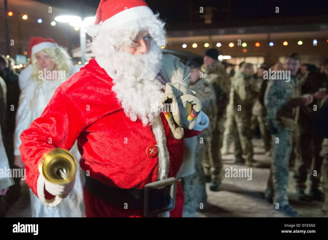 Soldier dressed up as Santa Claus comes to Christmas market in the Camp ...