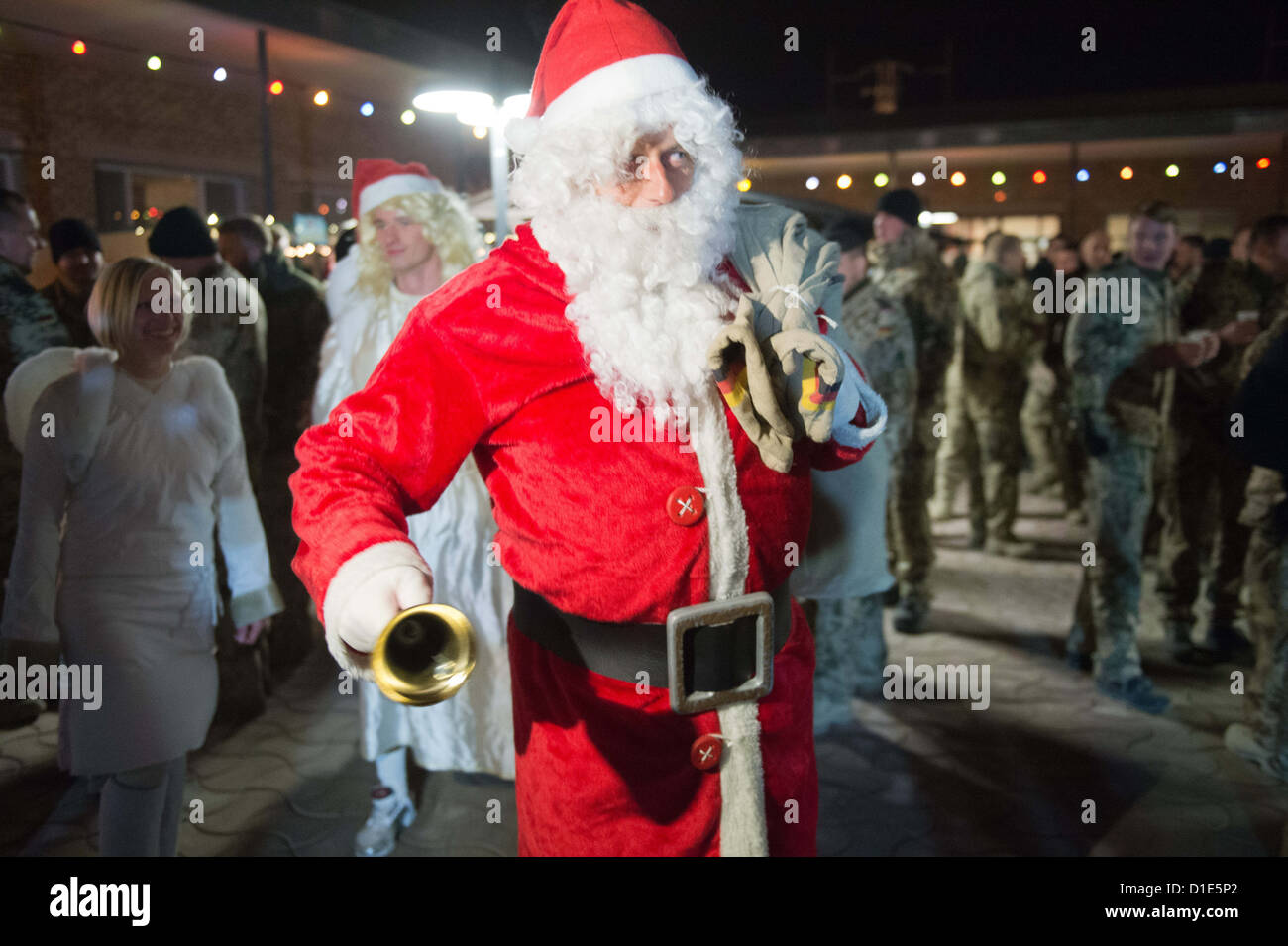 Soldier dressed up as Santa Claus comes to Christmas market in the Camp ...