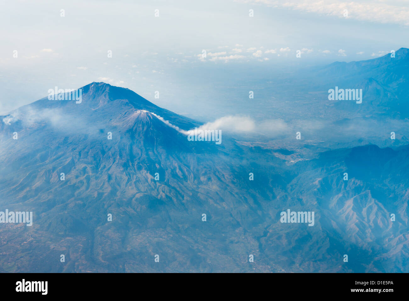 Volcano tops with smoke under sky, bird's eye view. Java island ...