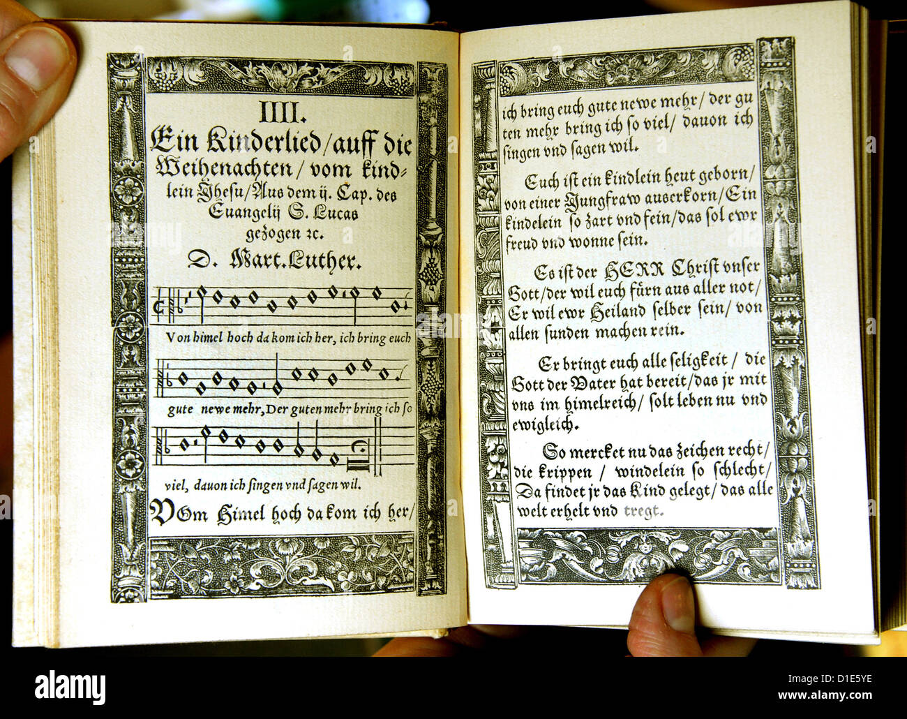 Director Anke Fiebiger presents christmas choir sheet music in the ...