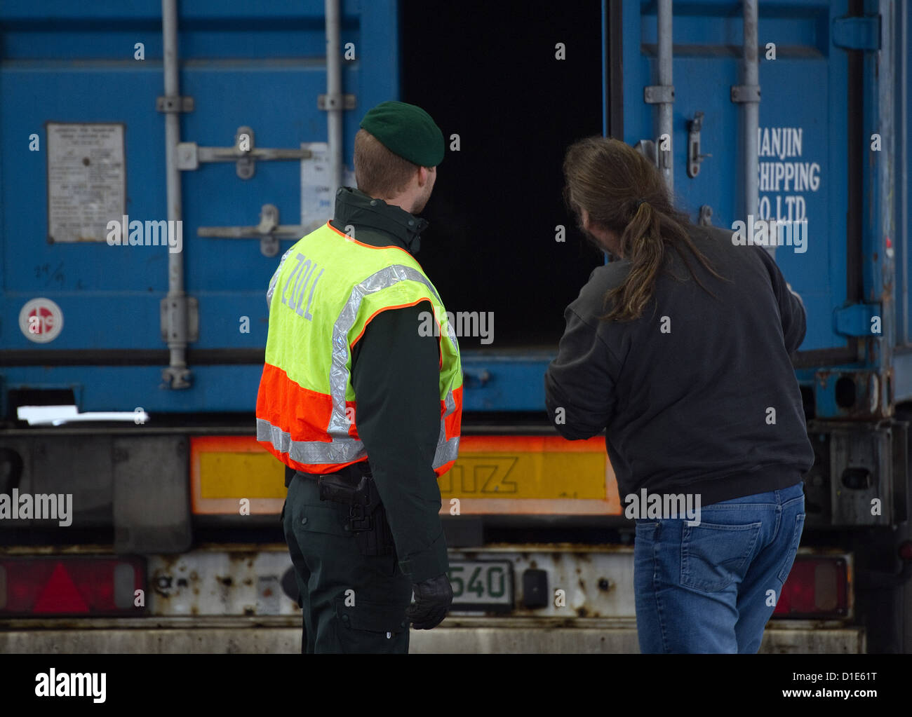 Customs officers check the freight of a truck at the Free Harbour ...