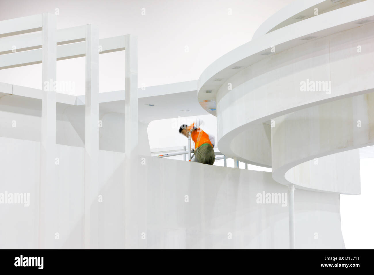 The man in orange erects the tower in the wonderful white ...