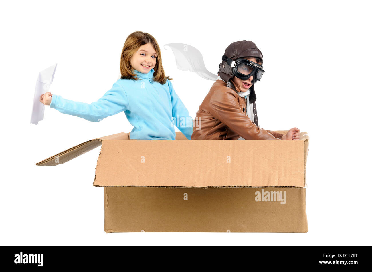 Young couple pilot flying a cardboard box isolated in white Stock Photo ...