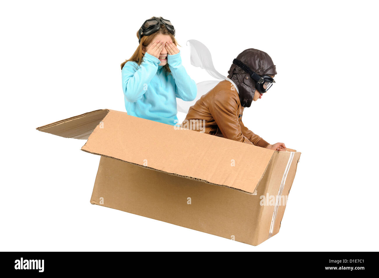 Young couple pilot flying a cardboard box isolated in white Stock Photo ...