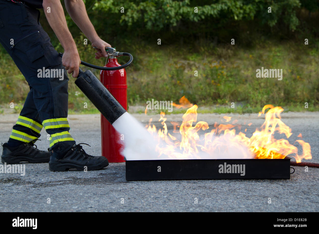 Fire extinguisher fighting safety hi-res stock photography and images ...