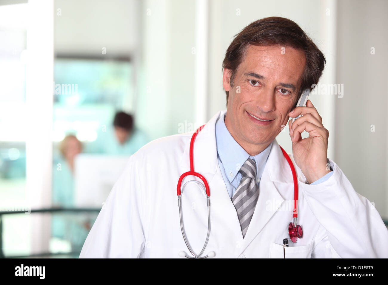 Doctor on the phone Stock Photo - Alamy
