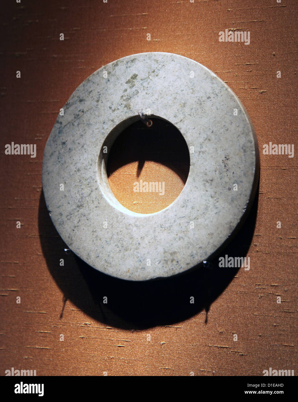 It's a photo of an ancient Chinese jade disc called bi. It was use as a ...