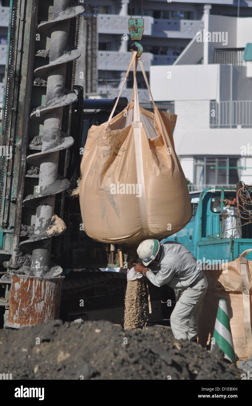 Naha (Okinawa, Japan), men at work in Yorimiya neighborhood Stock Photo ...