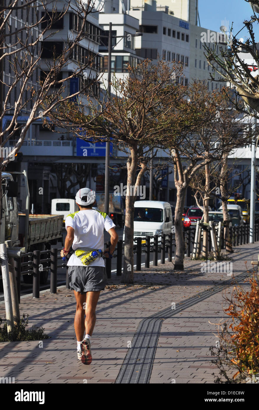 Naha (Okinawa, Japan), man jogging along Route 58th Stock Photo - Alamy