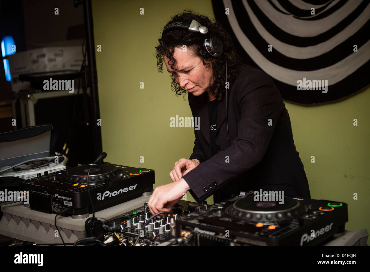 A DJ lining up music to play at a dance party rave disco, UK Stock ...