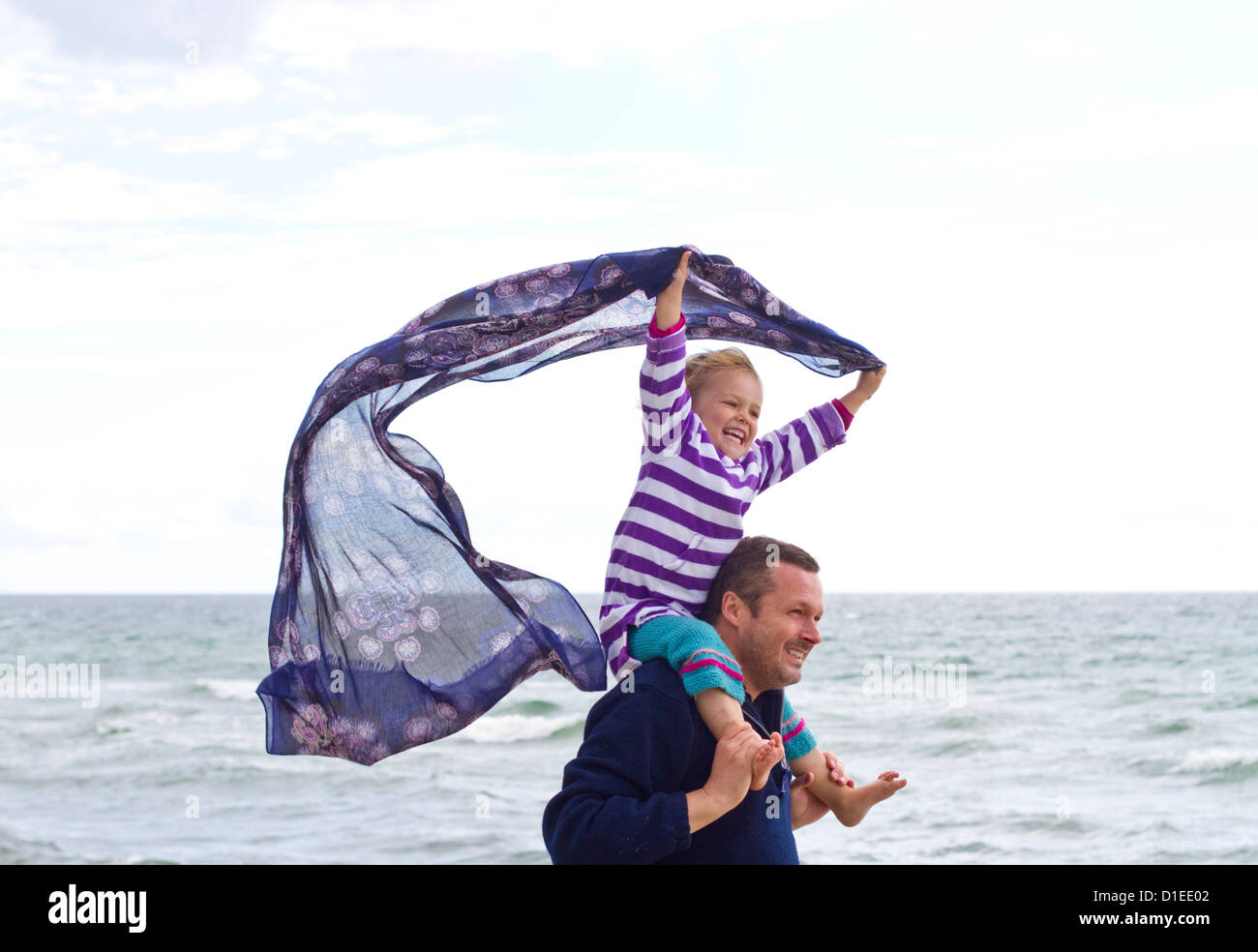 Father carrying daughter shoulders by sea hi-res stock photography and images - Alamy