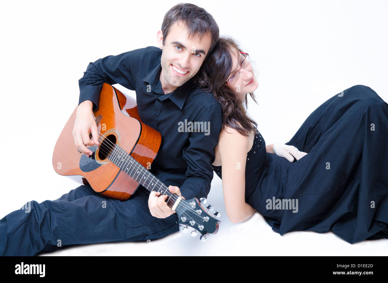 A couple of lovers singing at guitar Stock Photo - Alamy