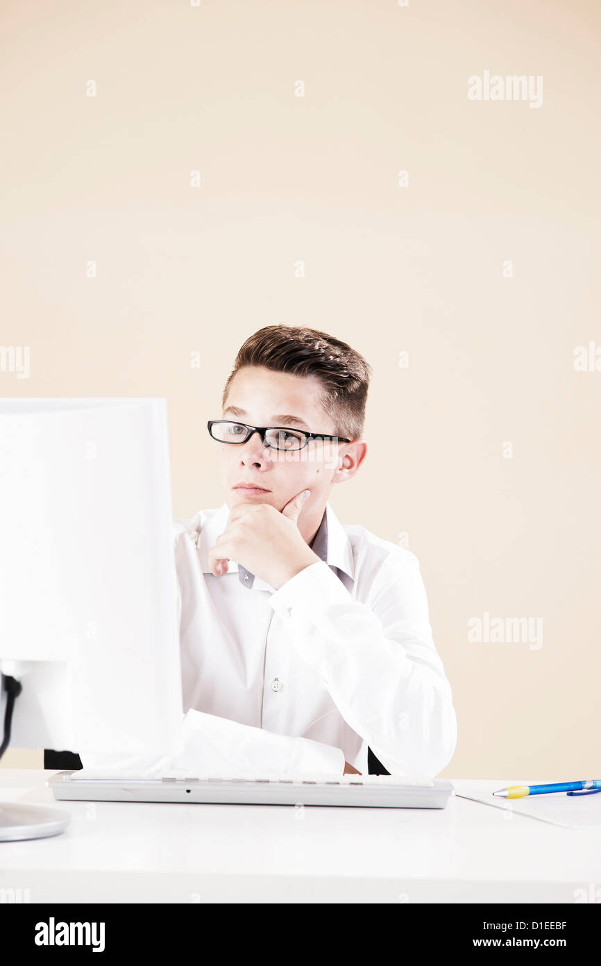 Teenage boy working at computer Stock Photo - Alamy