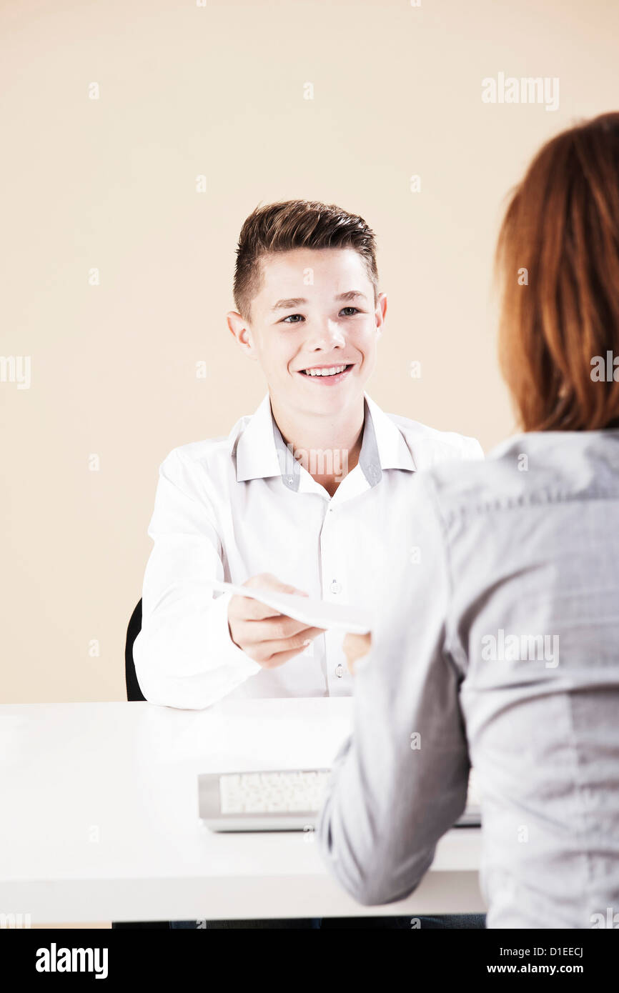 Teenage boy having a job interview Stock Photo - Alamy