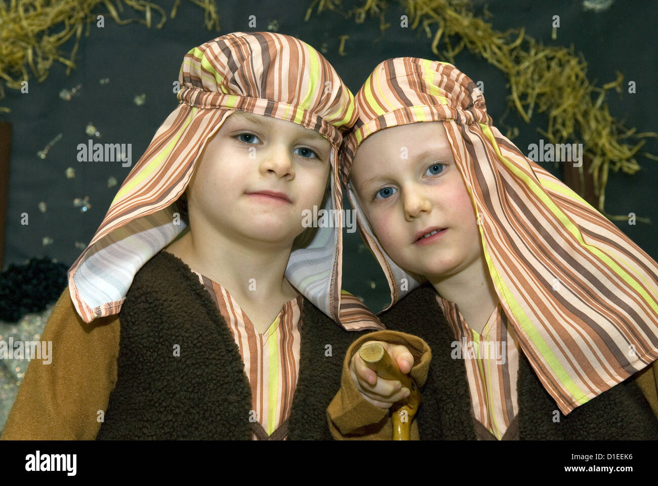 Two young pupils dressed as shepherds for school nativity play ...