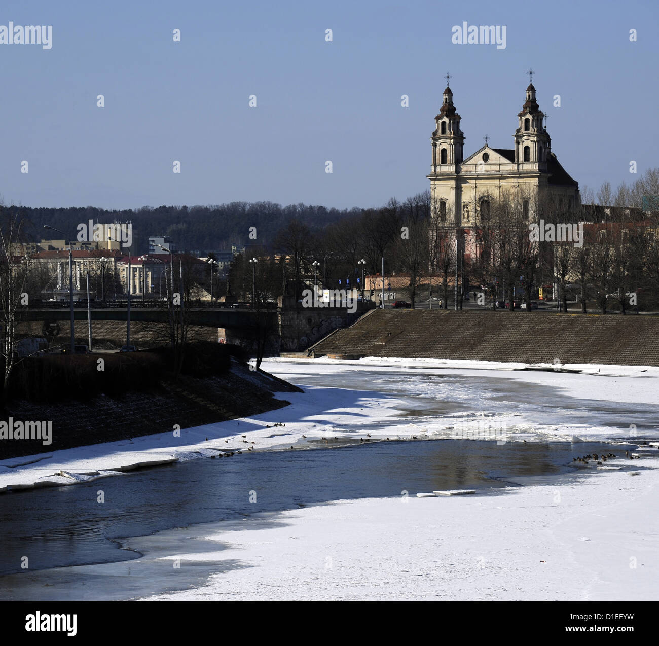 Lithuania. Vilnius. Frozen waters of the Neris river. At background ...
