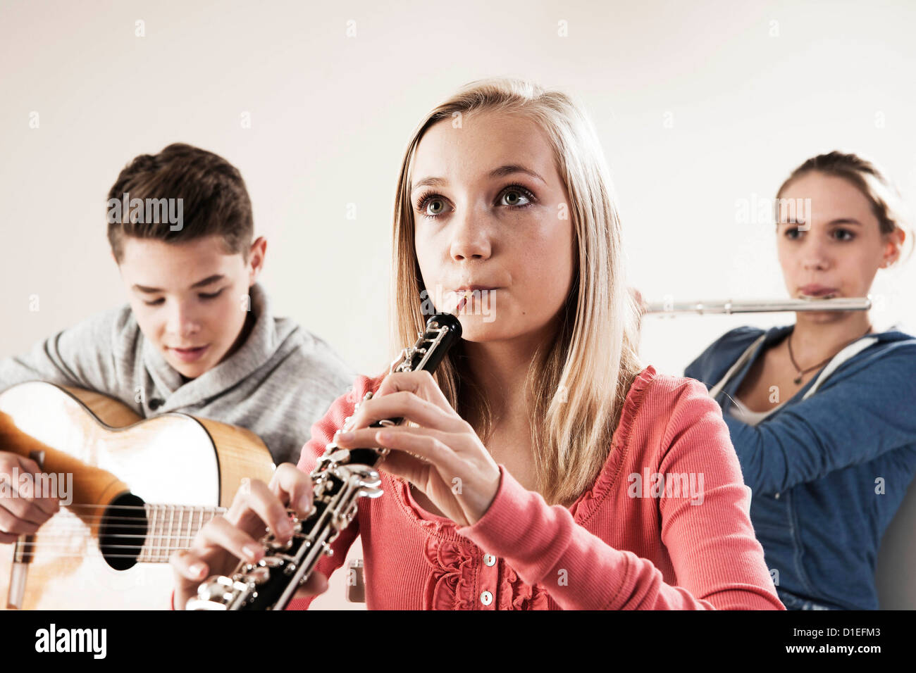 Teenager playing music Stock Photo - Alamy