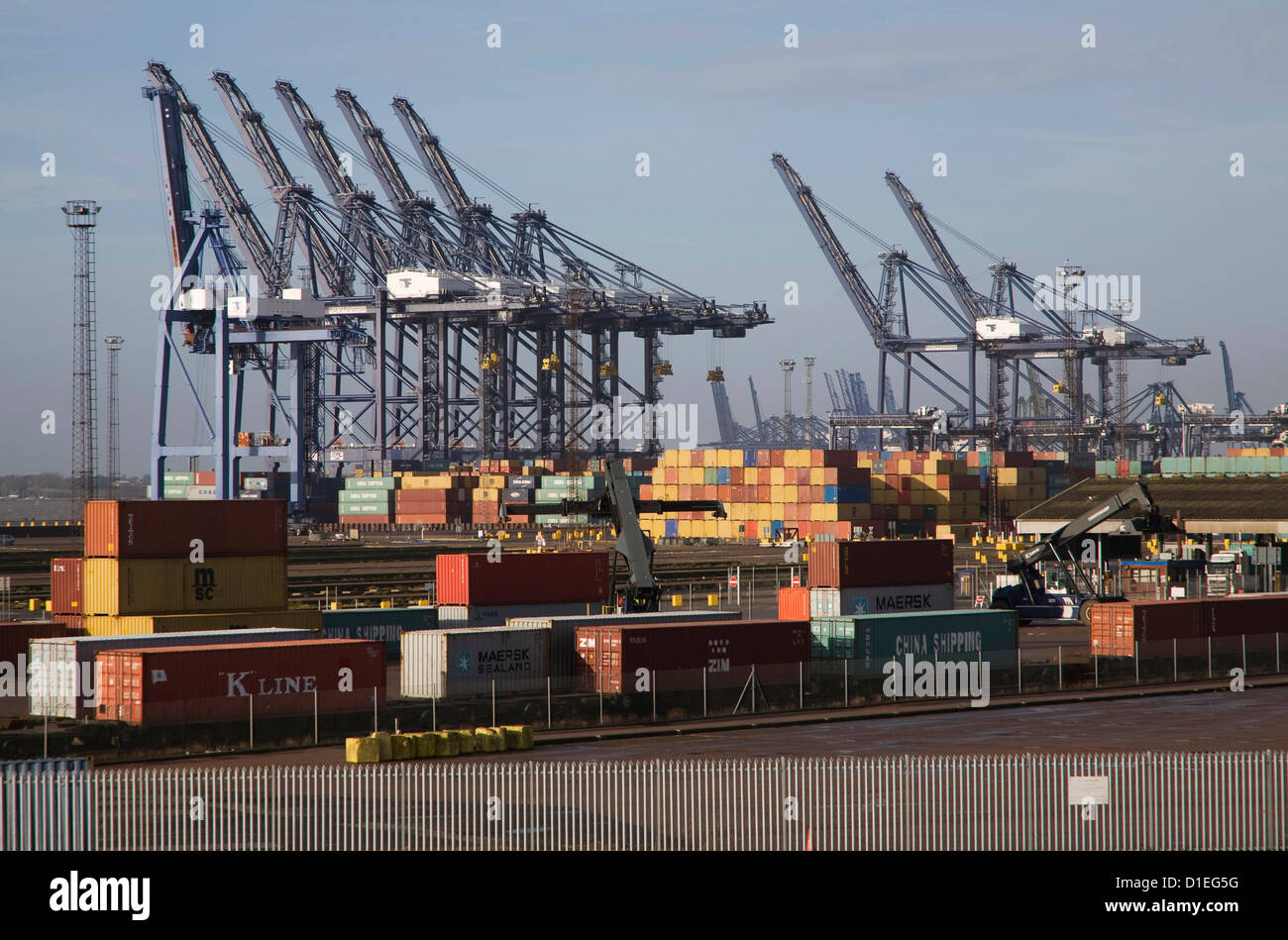Cranes and stacked containers on quayside Port of Felixstowe Suffolk ...