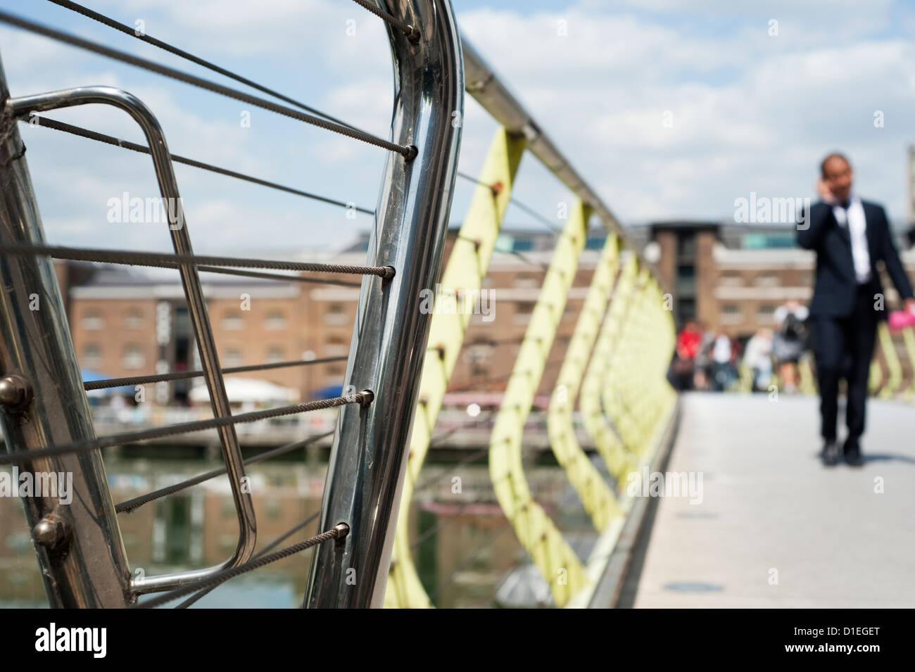 The floating pontoon bridge in the North Quay at Canary Wharf, London ...