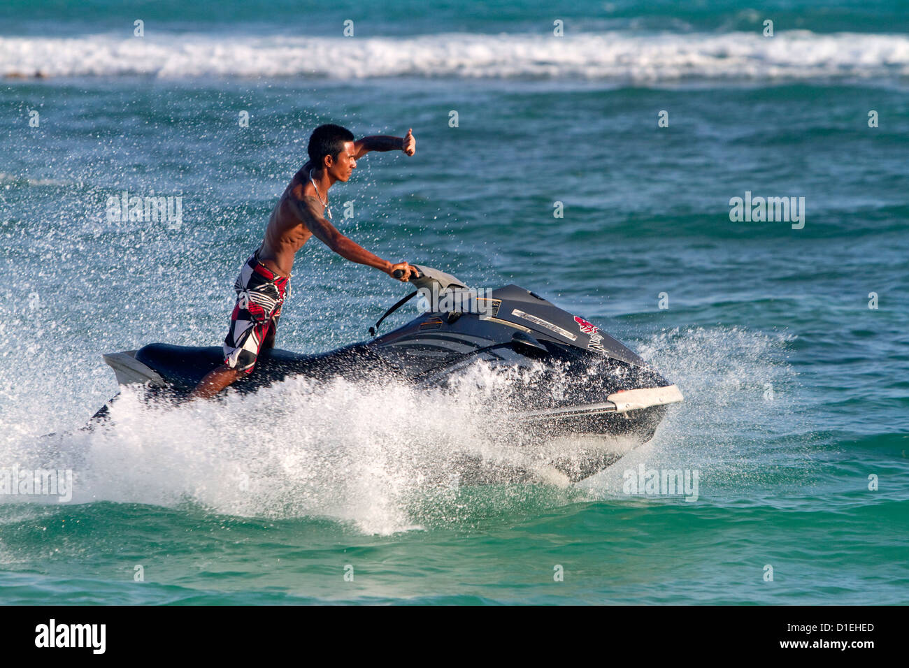 Man riding a personal water craft in the Gulf of Thailand at Chaweng ...