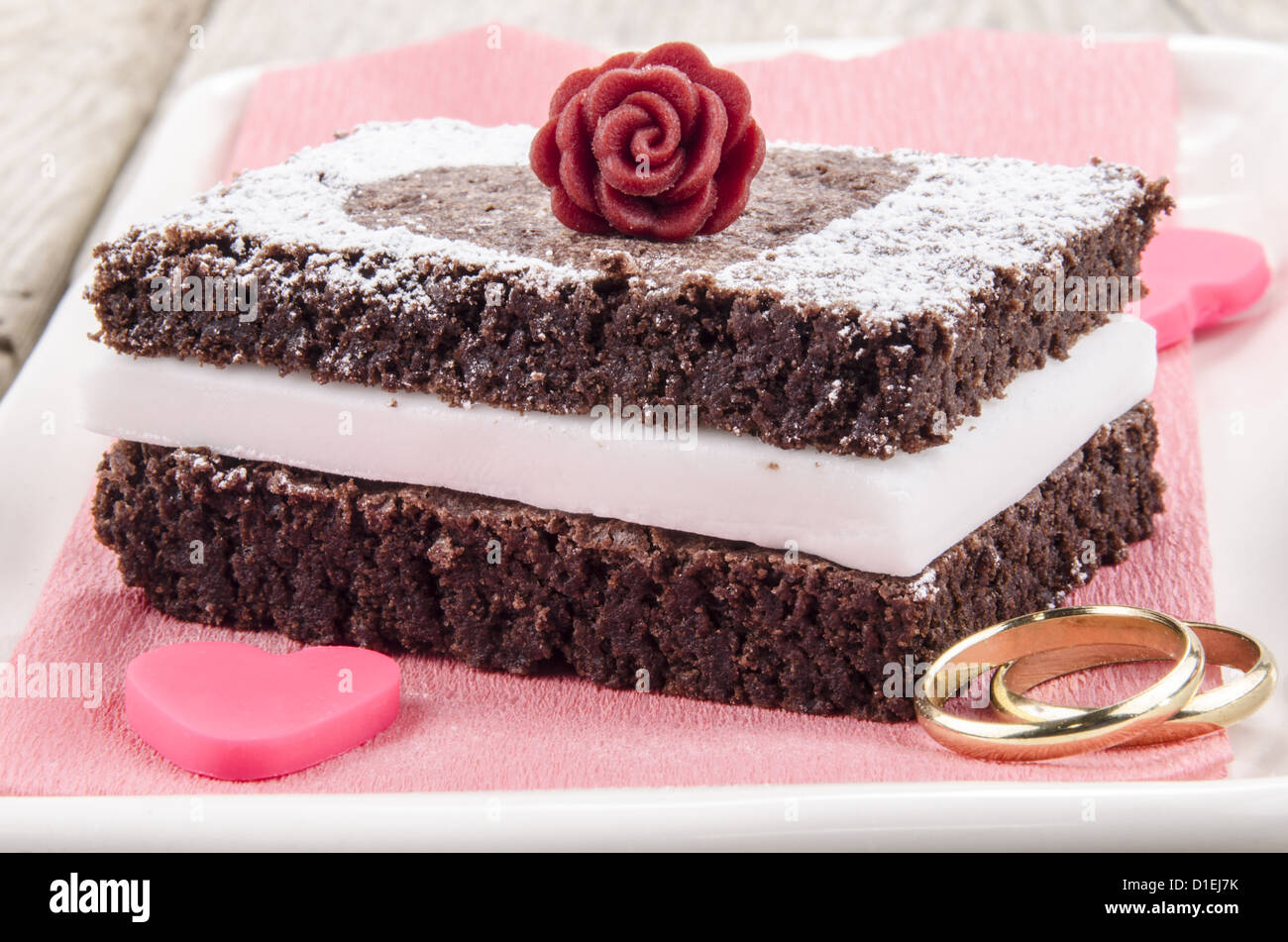 valentine cake with a red rose and powdered sugar Stock Photo - Alamy