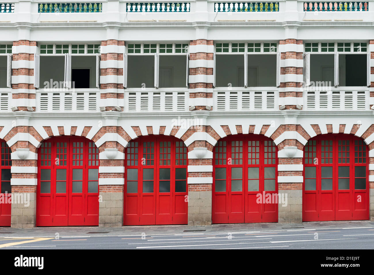 Facade of old fire station with red gates Stock Photo - Alamy