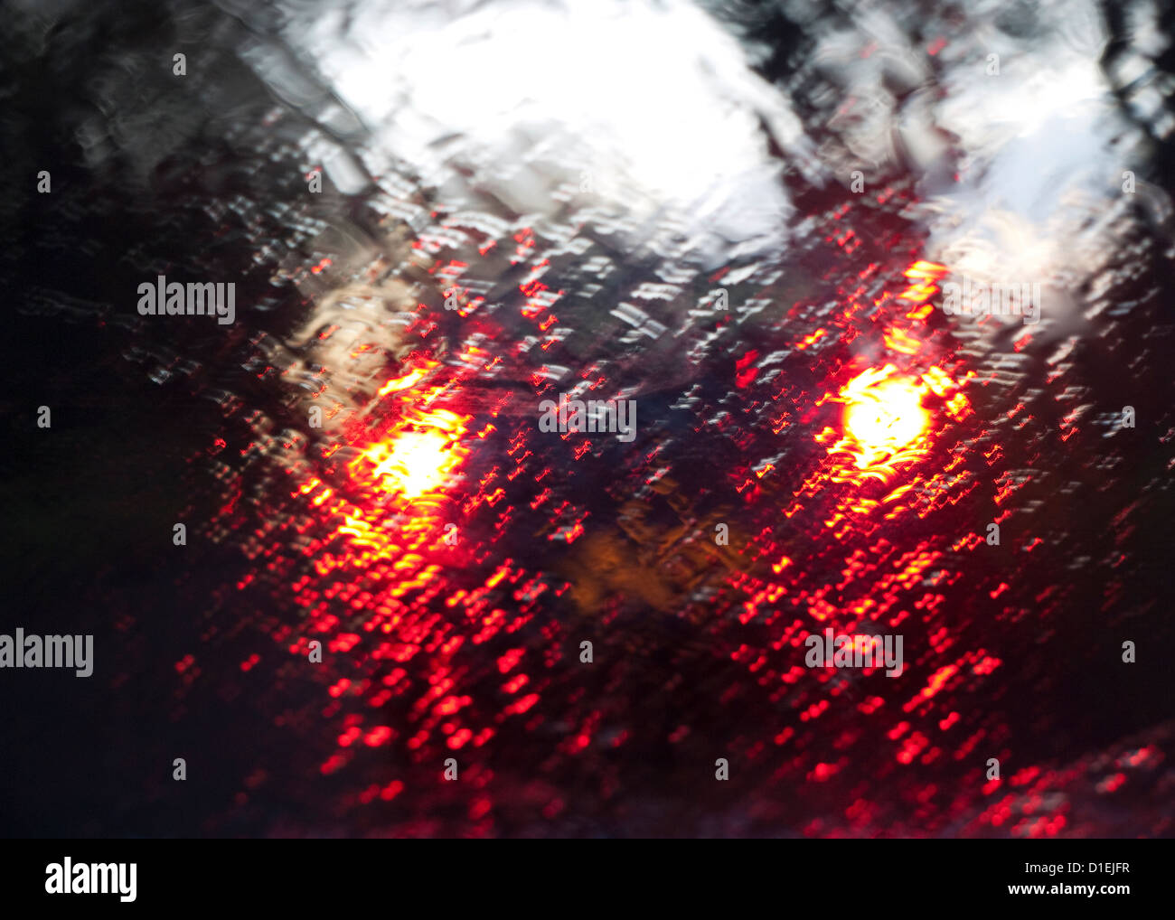 car brake lights through wet windscreen glass Stock Photo - Alamy