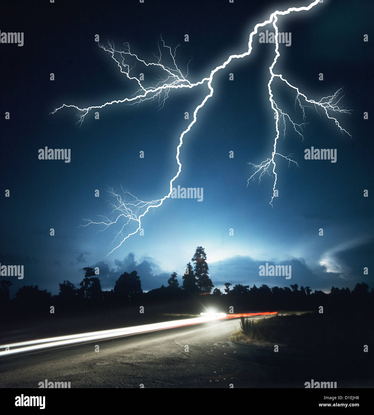 cars lonely road lightning storm at night Stock Photo - Alamy