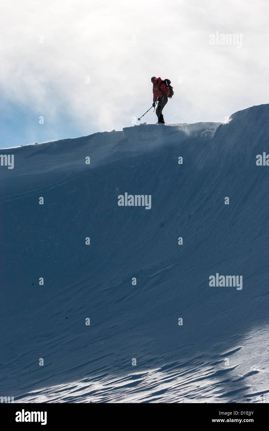 Backcountry skier at the edge of a cornice on Tenderfoot Pass, Wallowa ...