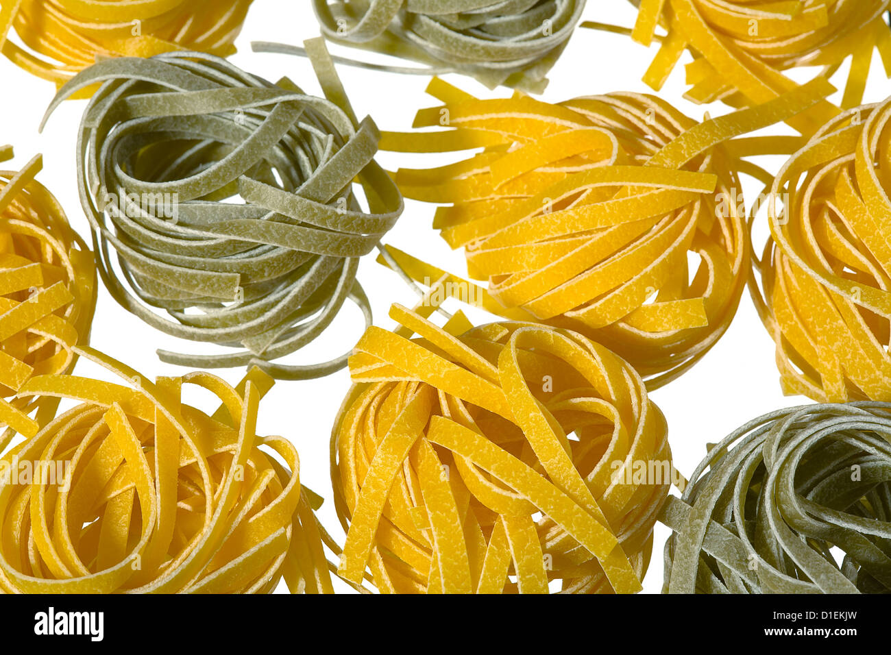 A raw colored pasta isolated on white background Stock Photo - Alamy