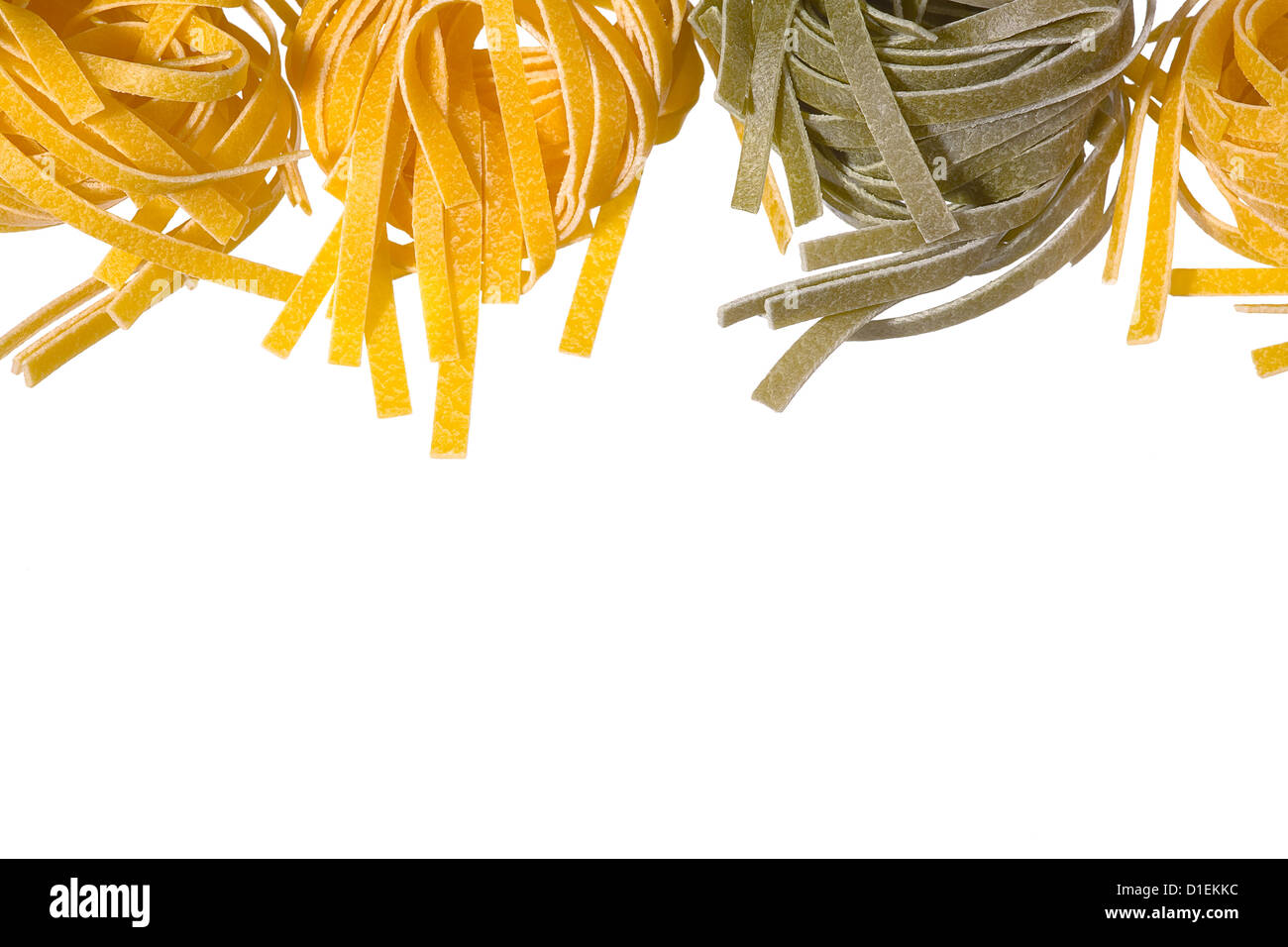 A raw colored pasta isolated on white background Stock Photo - Alamy