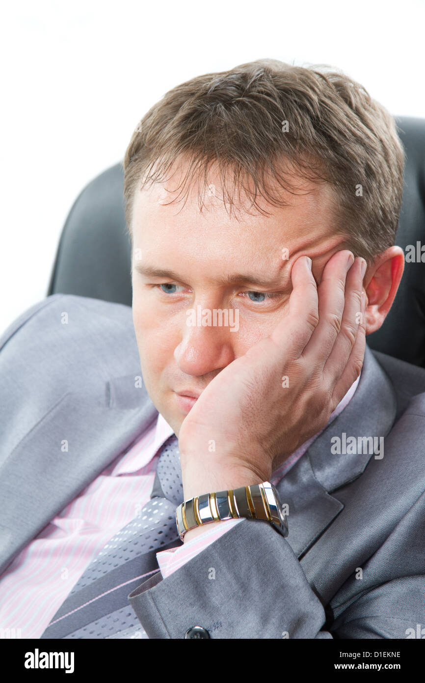 portrait of thoughtful and tired manager at the end of the day on an ...